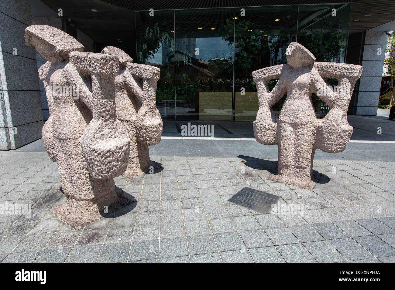 1 Aug 2024. Stone sculptures that depict three Samsui women lifted ...