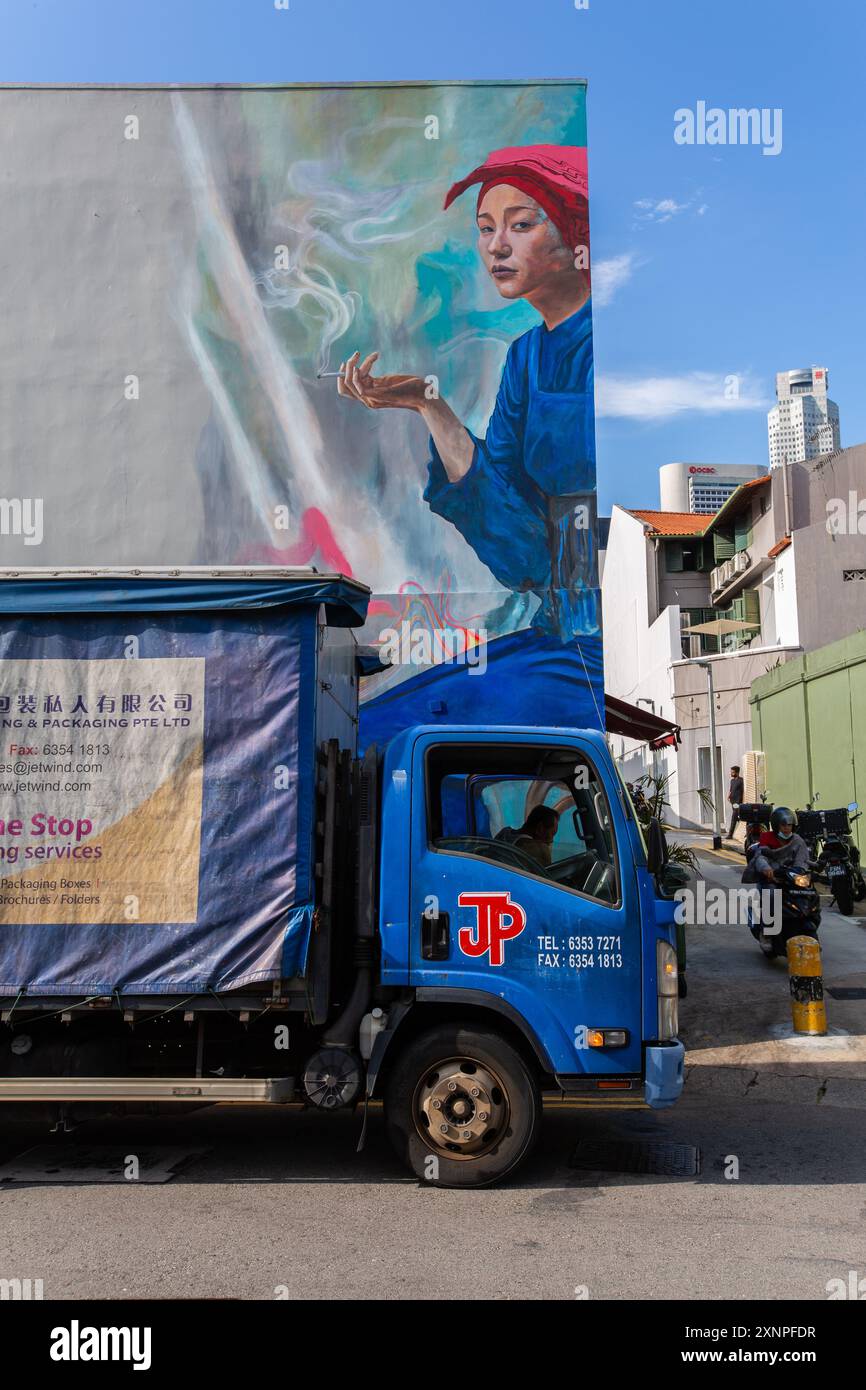 Woman beside colourful wall hi-res stock photography and images - Alamy