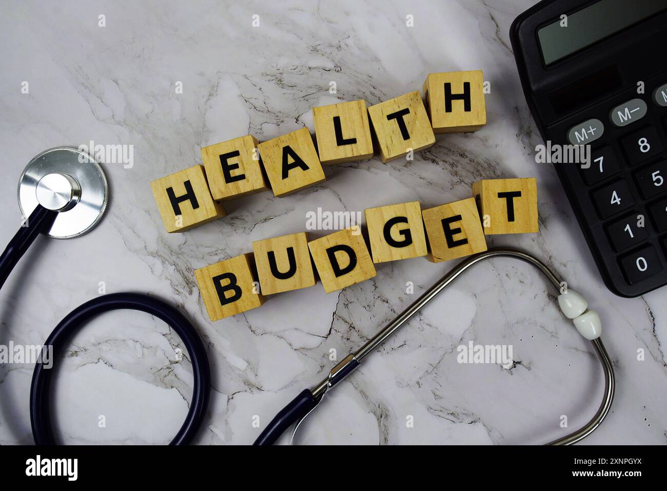 Health Budget with wooden blocks alphabet letters and stethoscope and ...
