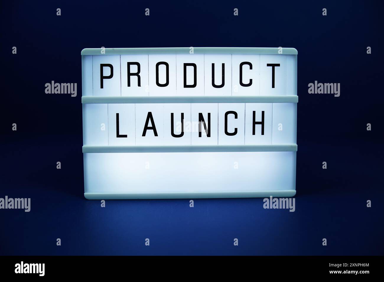 Product Launch letterboard text on LED Lightbox on blue background ...