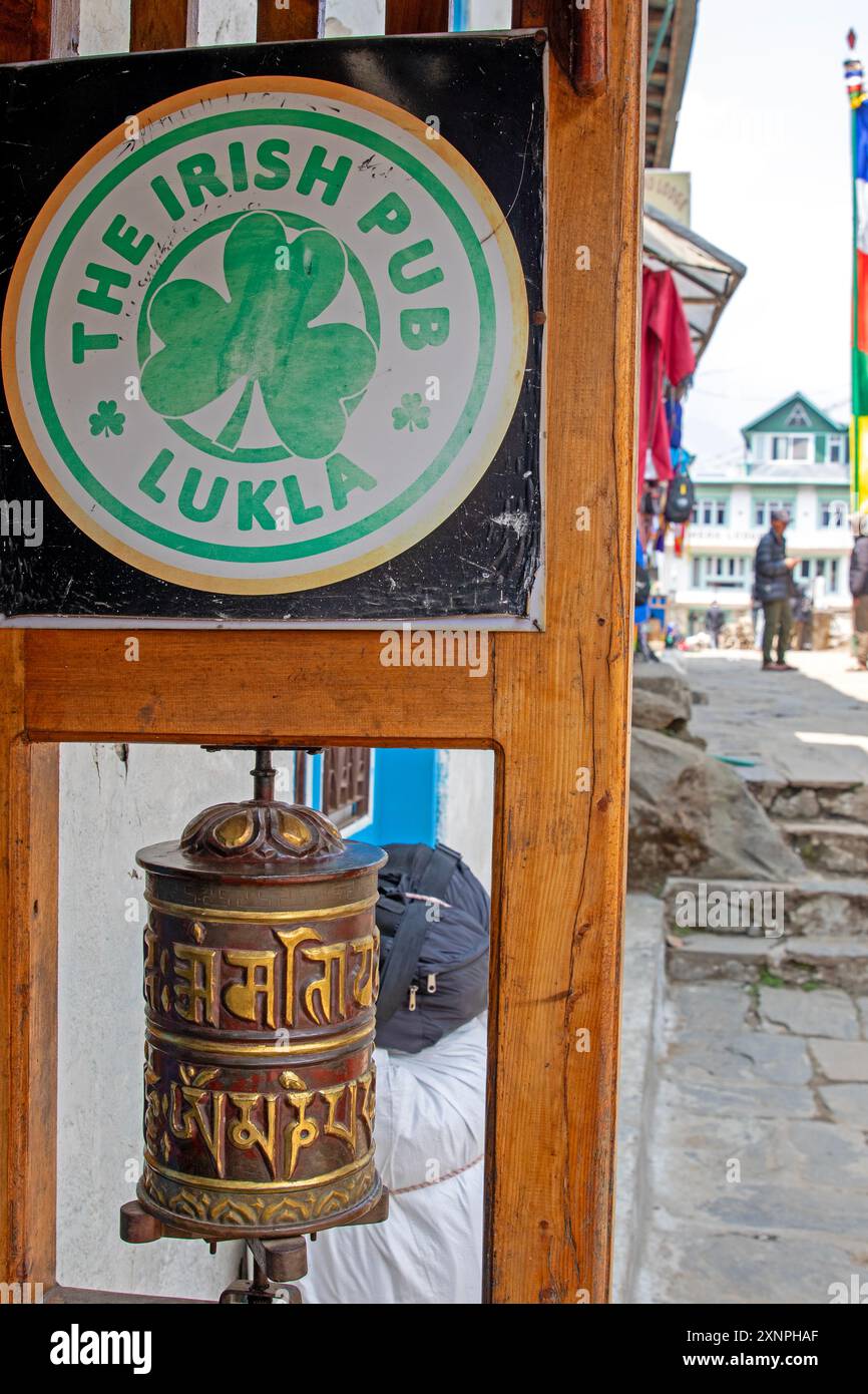 Prayer wheel at the entrance to the Irish Pub in Lukla Stock Photo - Alamy
