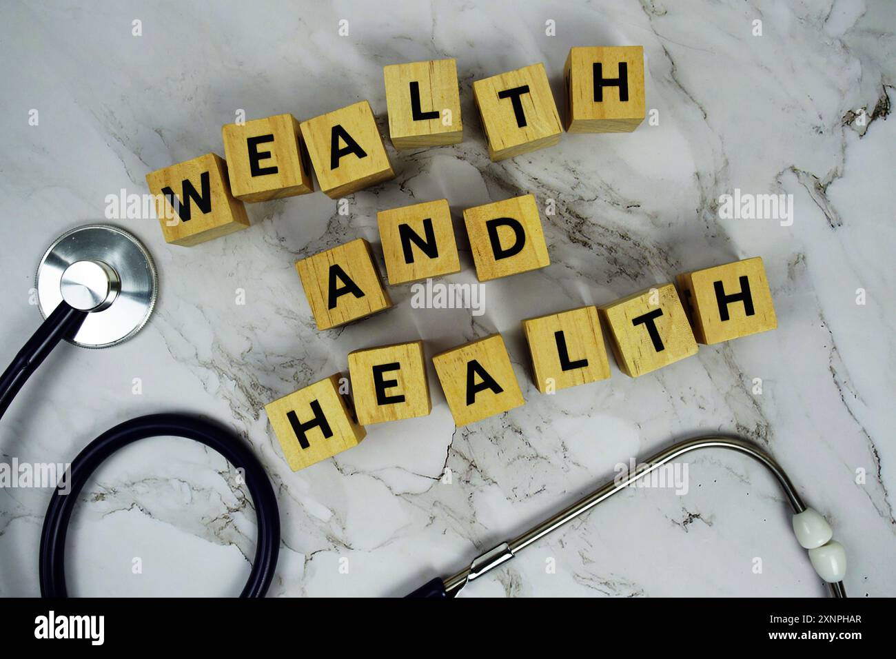 Wealth and Health with wooden blocks alphabet letters and stethoscope ...