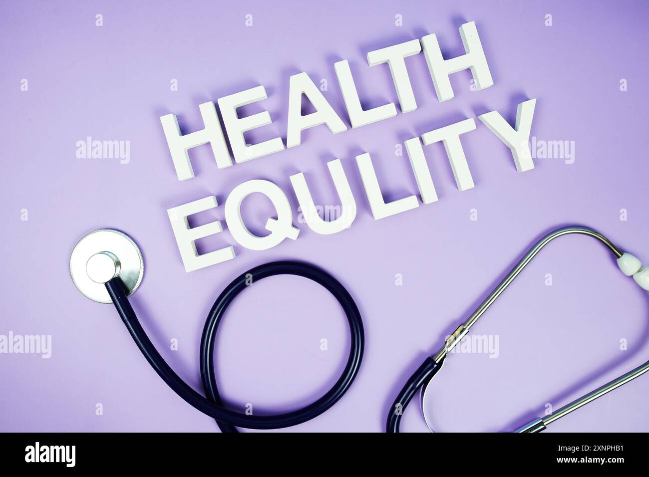 Health Equlity alphabet letters and stethoscope on purple background ...