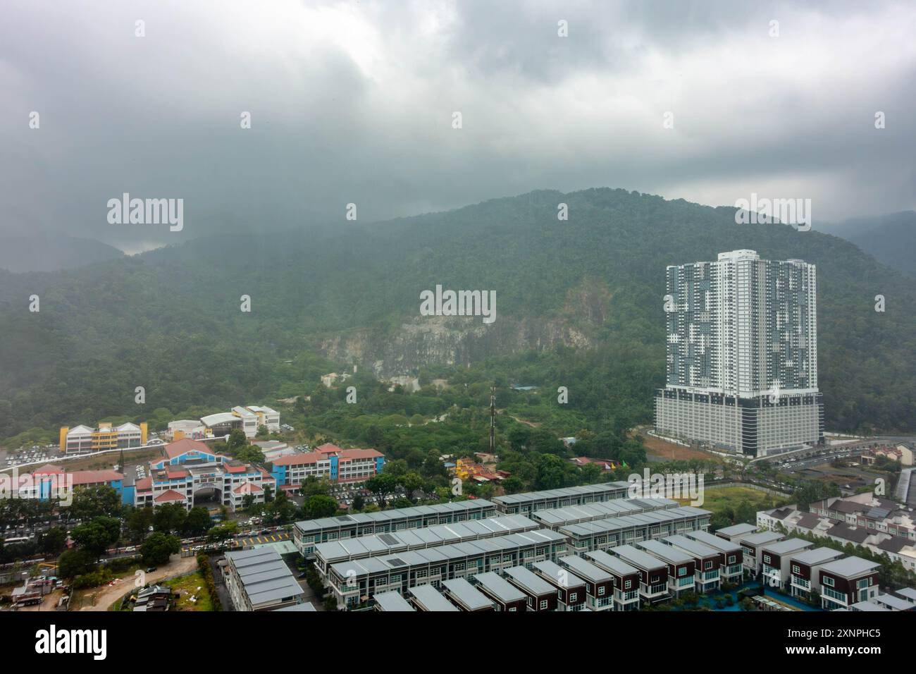 Clouds roll in over the hillside in Tanjung Bungah, Penang, Malaysia ...