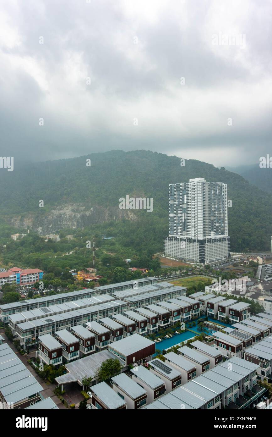 Clouds roll in over the hillside in Tanjung Bungah, Penang, Malaysia ...
