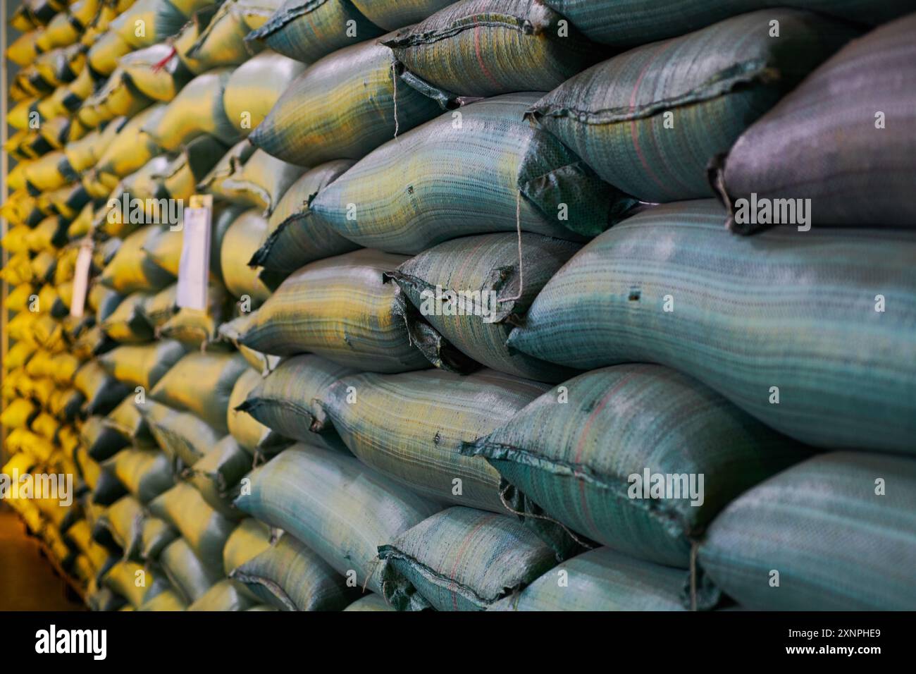 Bags of coffee beans stacked in a factory in Vietnam Stock Photo - Alamy