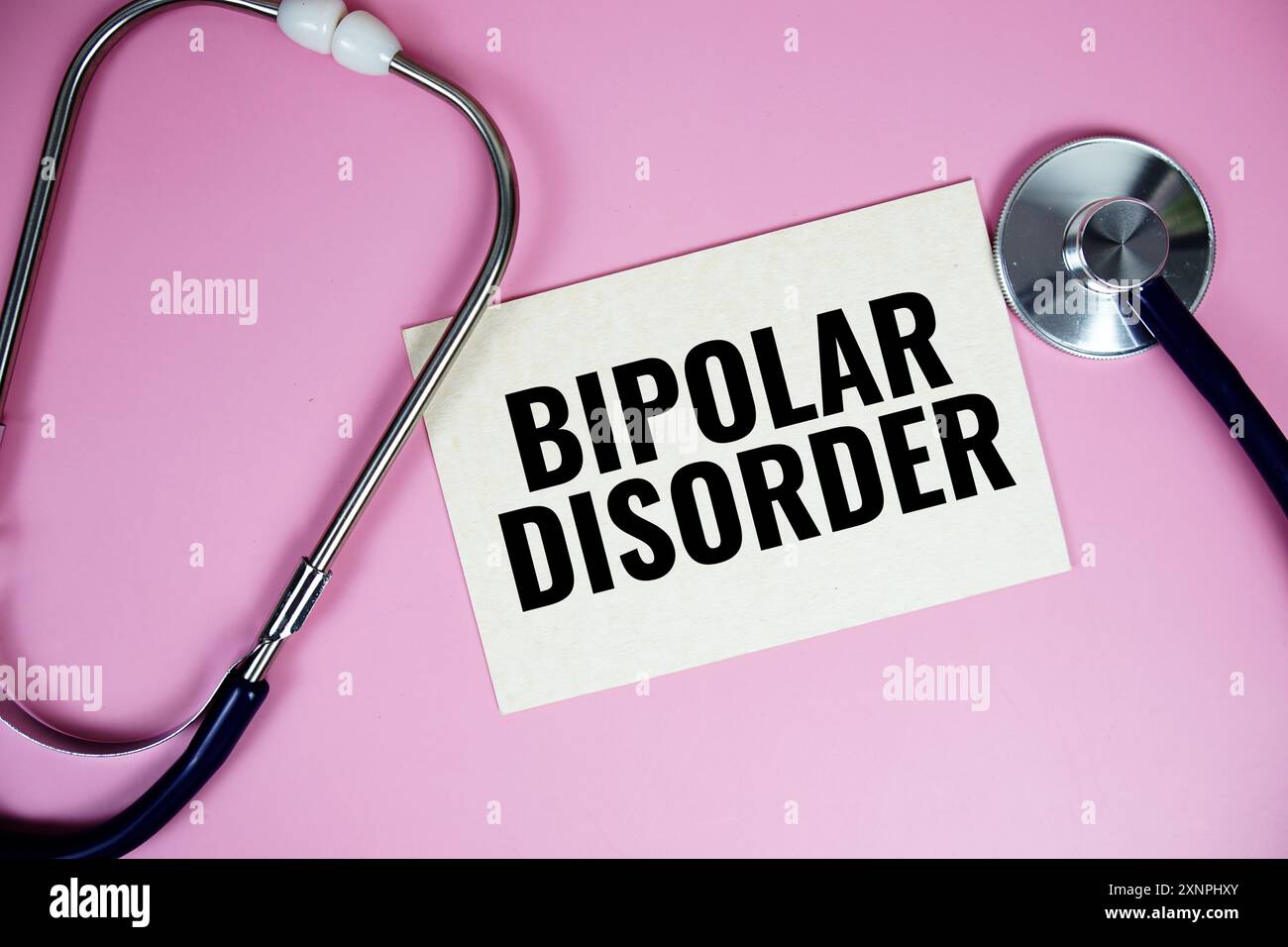 Bipolar Disorder text with stethoscope top view on pink background ...