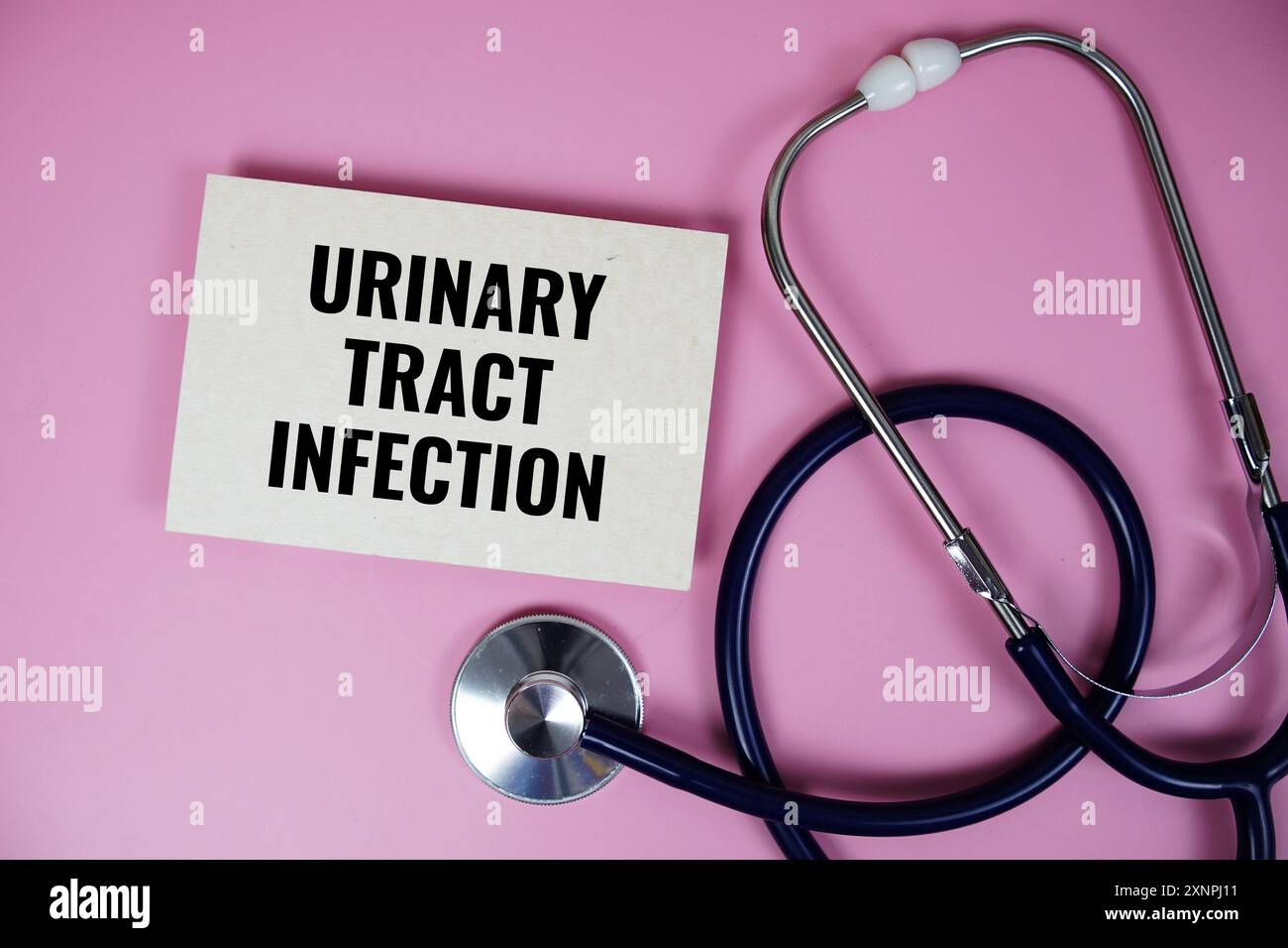 Urinary Tract Infection text with stethoscope on pink background ...
