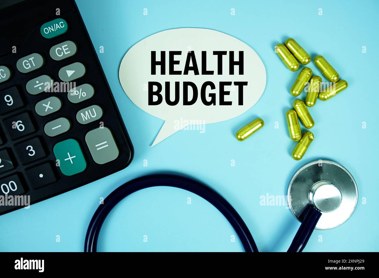 Health Budget text with calculator, stethoscope and capsule medicine on ...