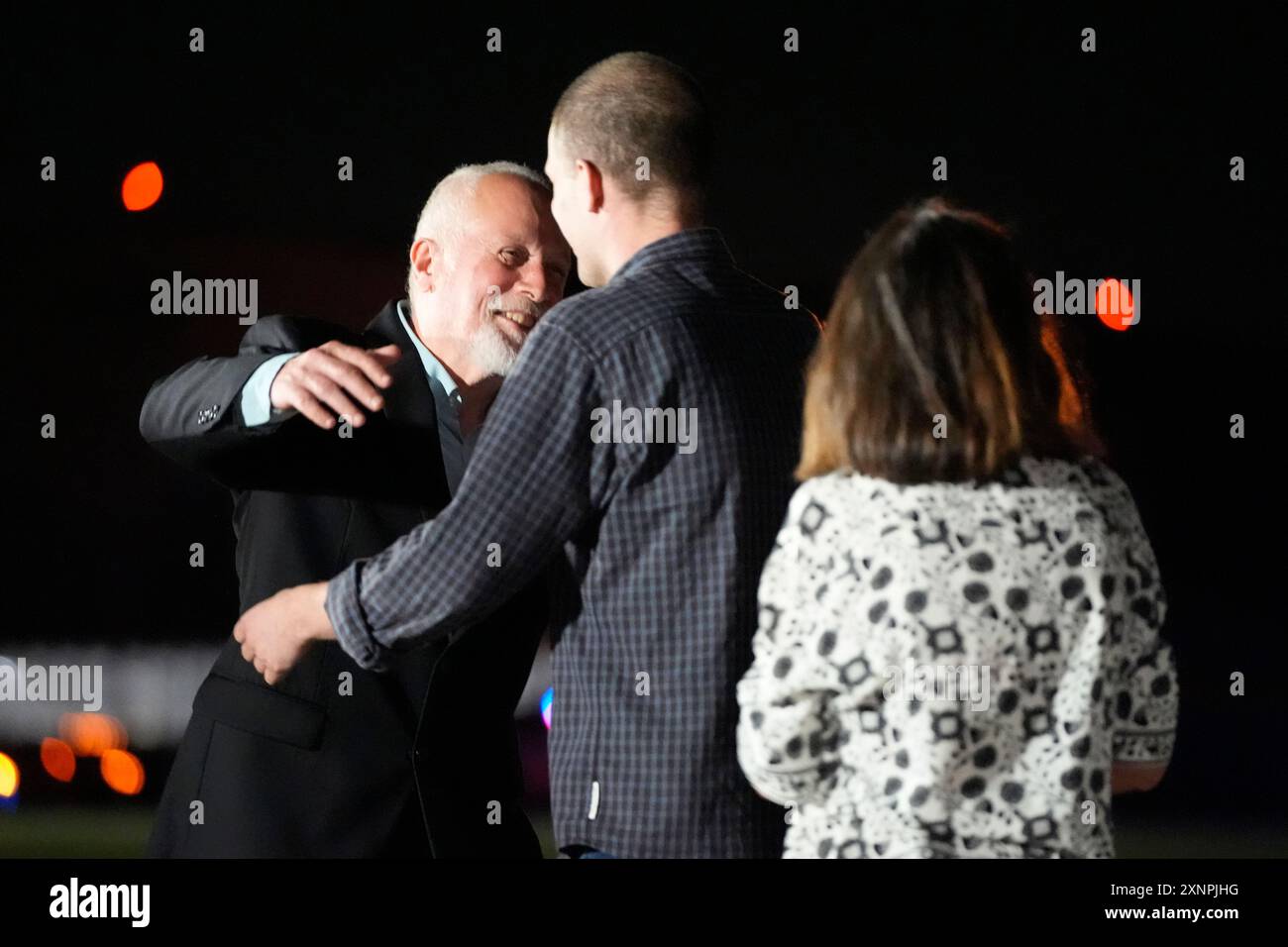 Reporter Evan Gershkovich, center, hugs his father Mikhail Gershkovich ...