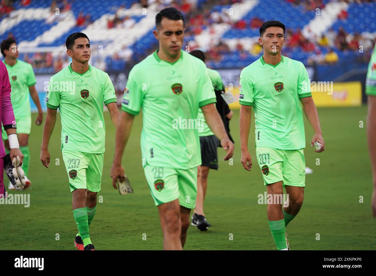 FC Juarez players walk toward the bench moments before the start of the ...