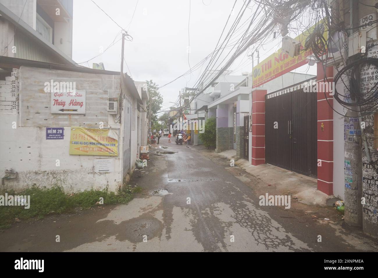Back alley in the outskirts of HCM city in Vietnam Stock Photo - Alamy
