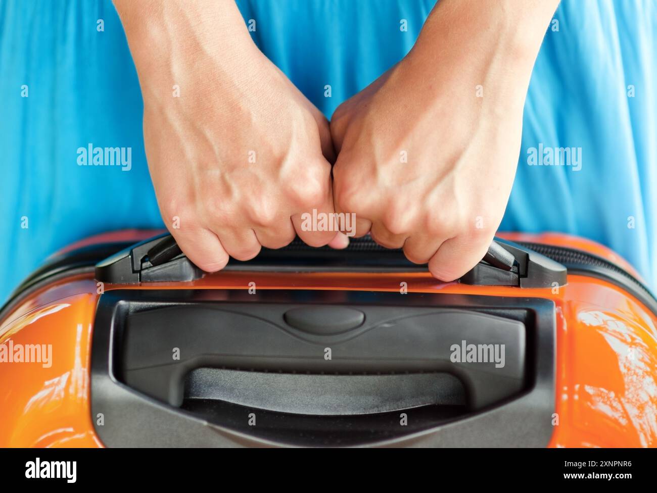 Travel red suitcase hand hi-res stock photography and images - Alamy