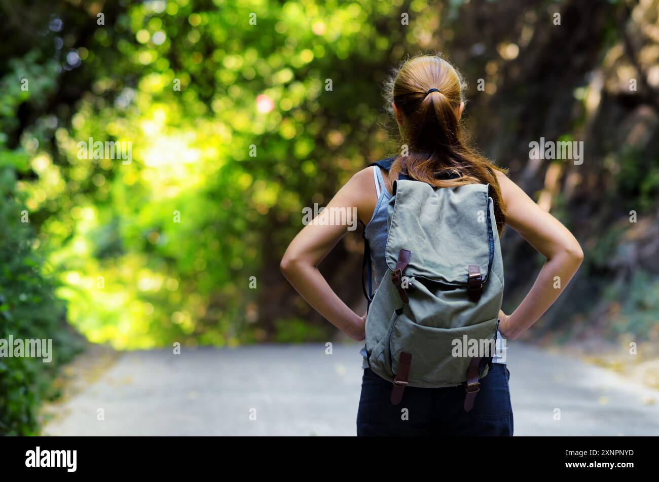 Young woman hiking with backpack Stock Photo - Alamy