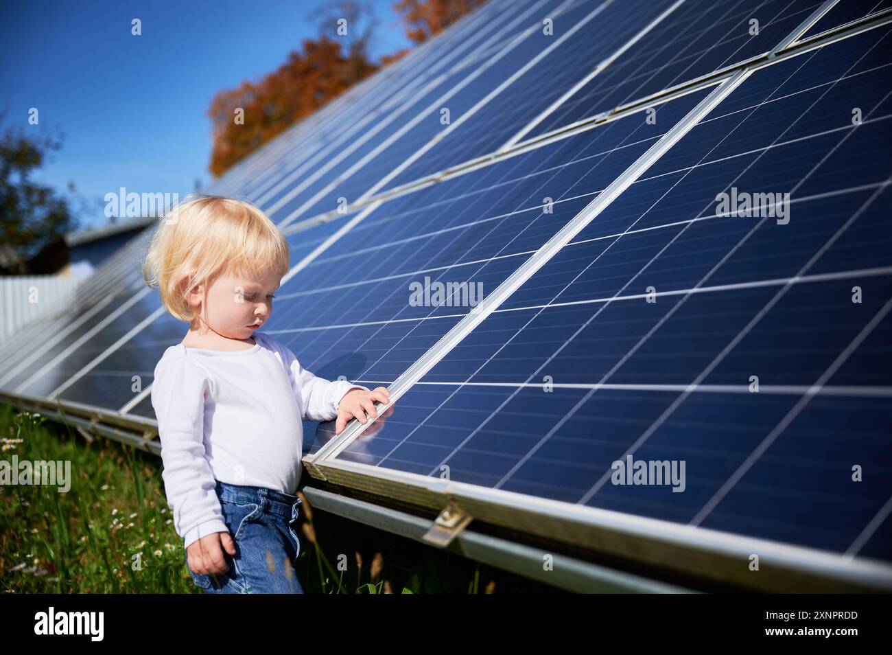 Little boy wondering what solar panel is. Inquisitive kid exploring how ...