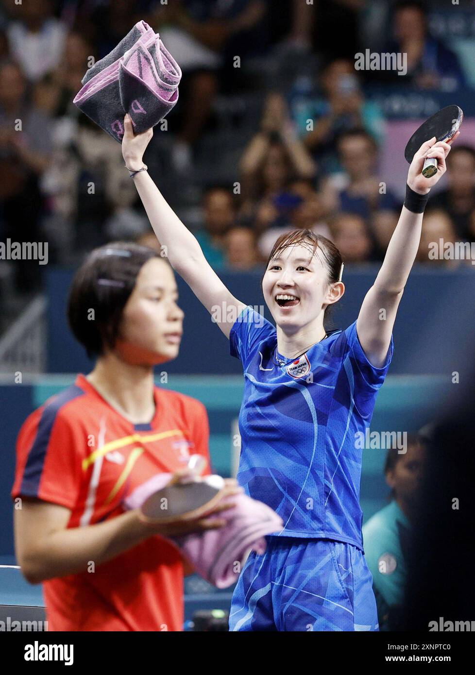 Japan's Hina Hayata (R) celebrates after defeating North Korea's Pyon ...