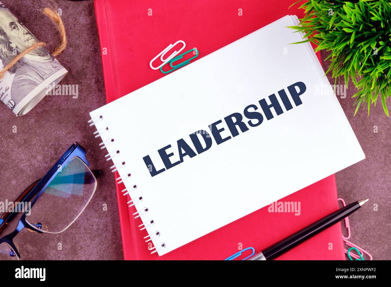 LEADERSHIP word written in a notebook on a blank sheet in a composition ...