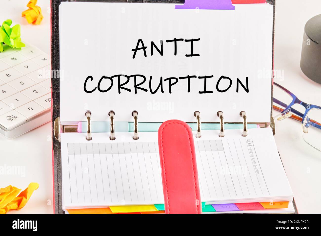 Concept of Anti Corruption written in an open notebook on a white ...