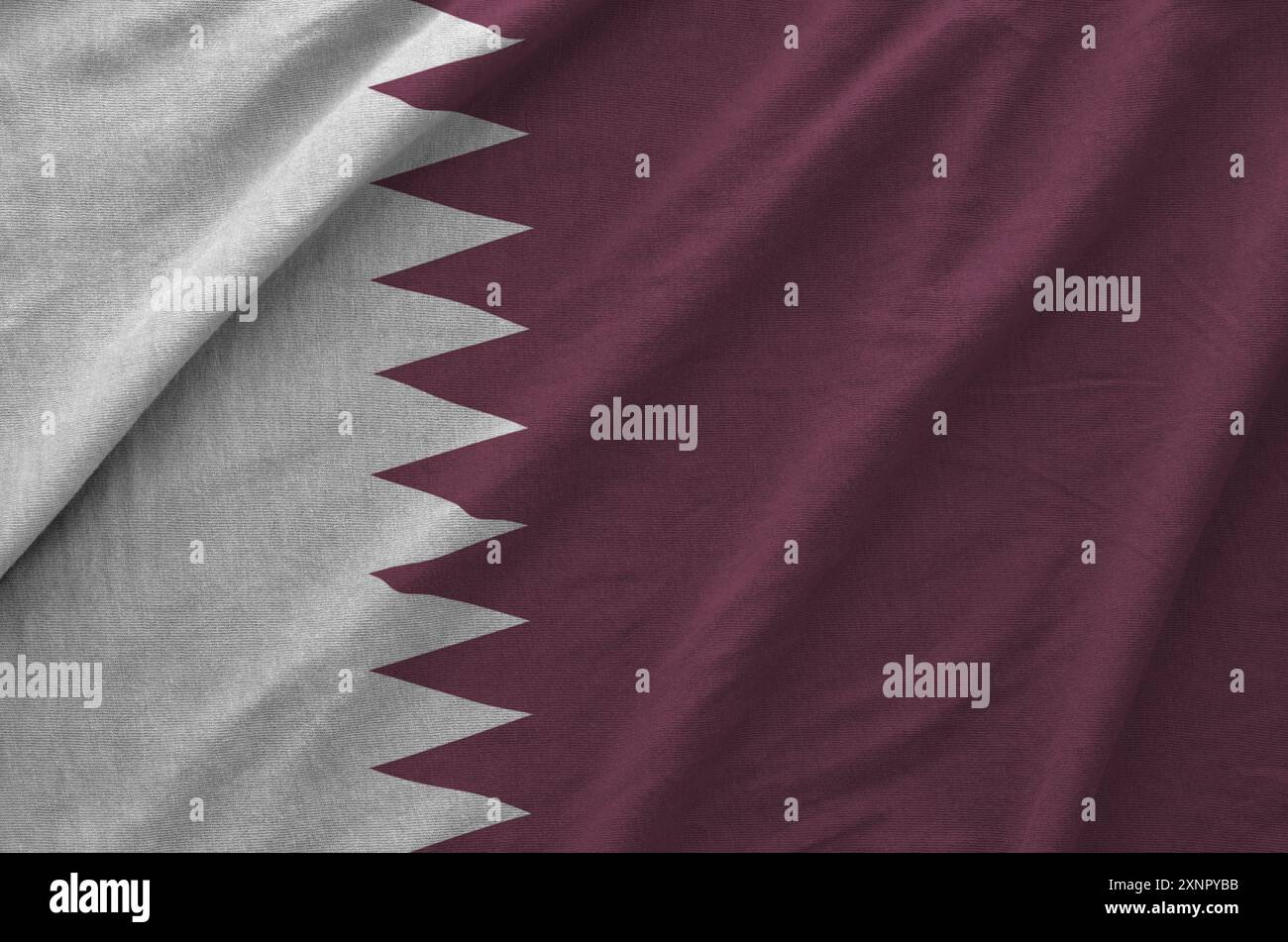 Qatar flag depicted on folded wavy fabric of old cloth close up Stock ...