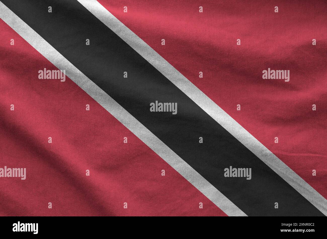 Trinidad and Tobago flag depicted on folded wavy fabric of old cloth ...