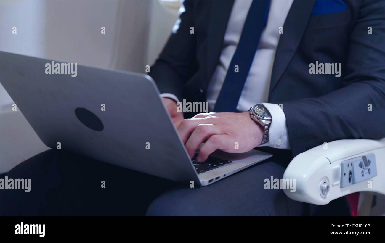 Man's hands typing on laptop keyboard .Businessman surfing net on ...