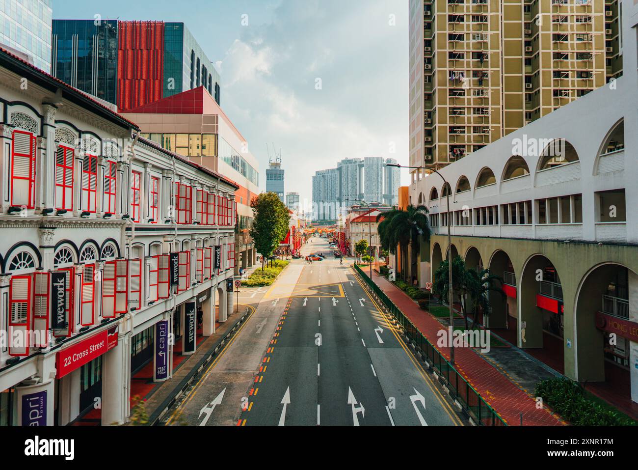 A vibrant street view of Cross Street in Singapore with traditional and ...
