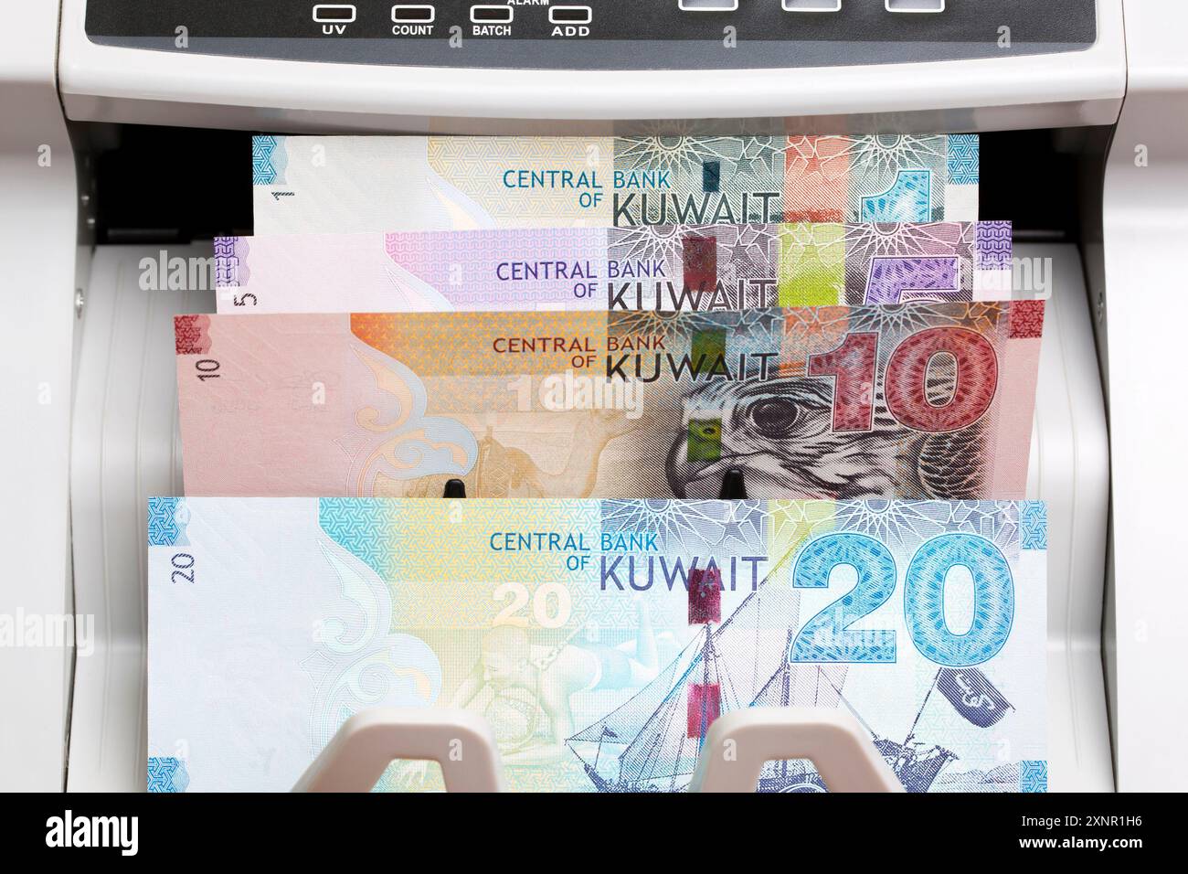 Kuwaiti money - dinar in the counting machine Stock Photo - Alamy