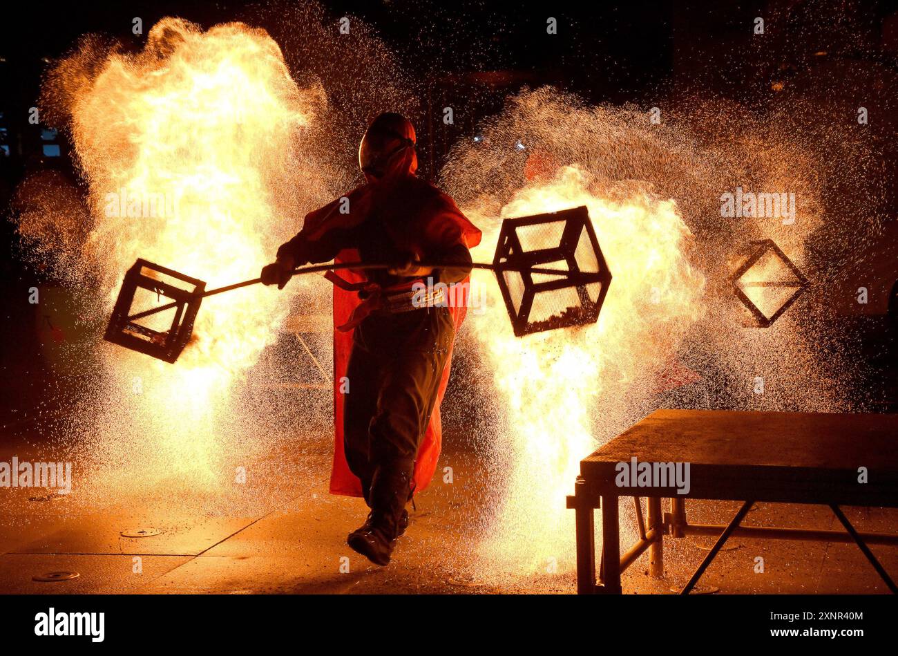 Handan, China. 02nd Aug, 2024. Artists are performing a fire-pot ...
