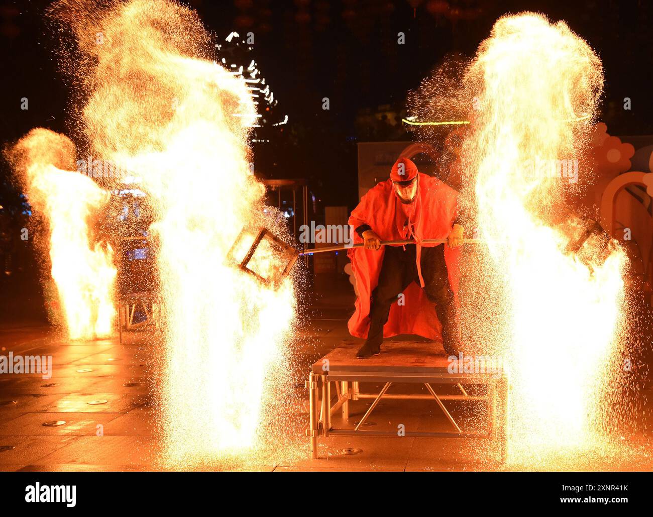 Handan, China. 02nd Aug, 2024. Artists are performing a fire-pot ...