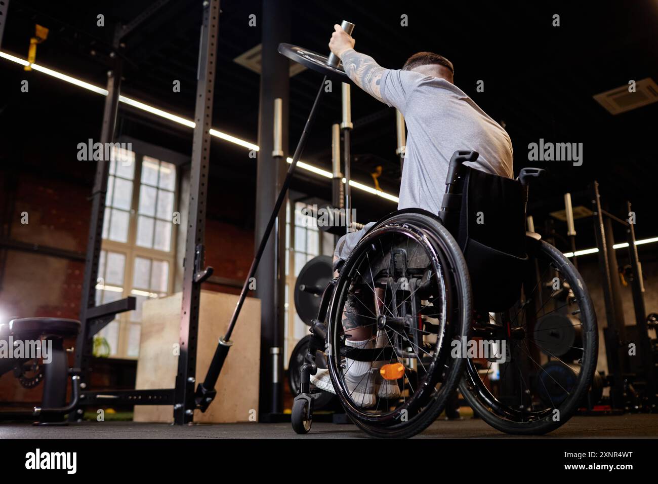 Wheelchair man lifting weight in hi-res stock photography and images ...
