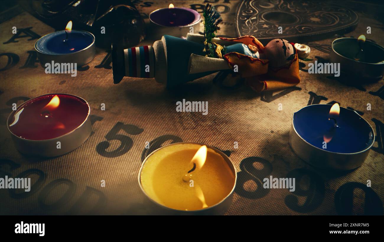 Witchcraft Ouija Board and Scary Voodoo Magic Doll Stock Photo - Alamy