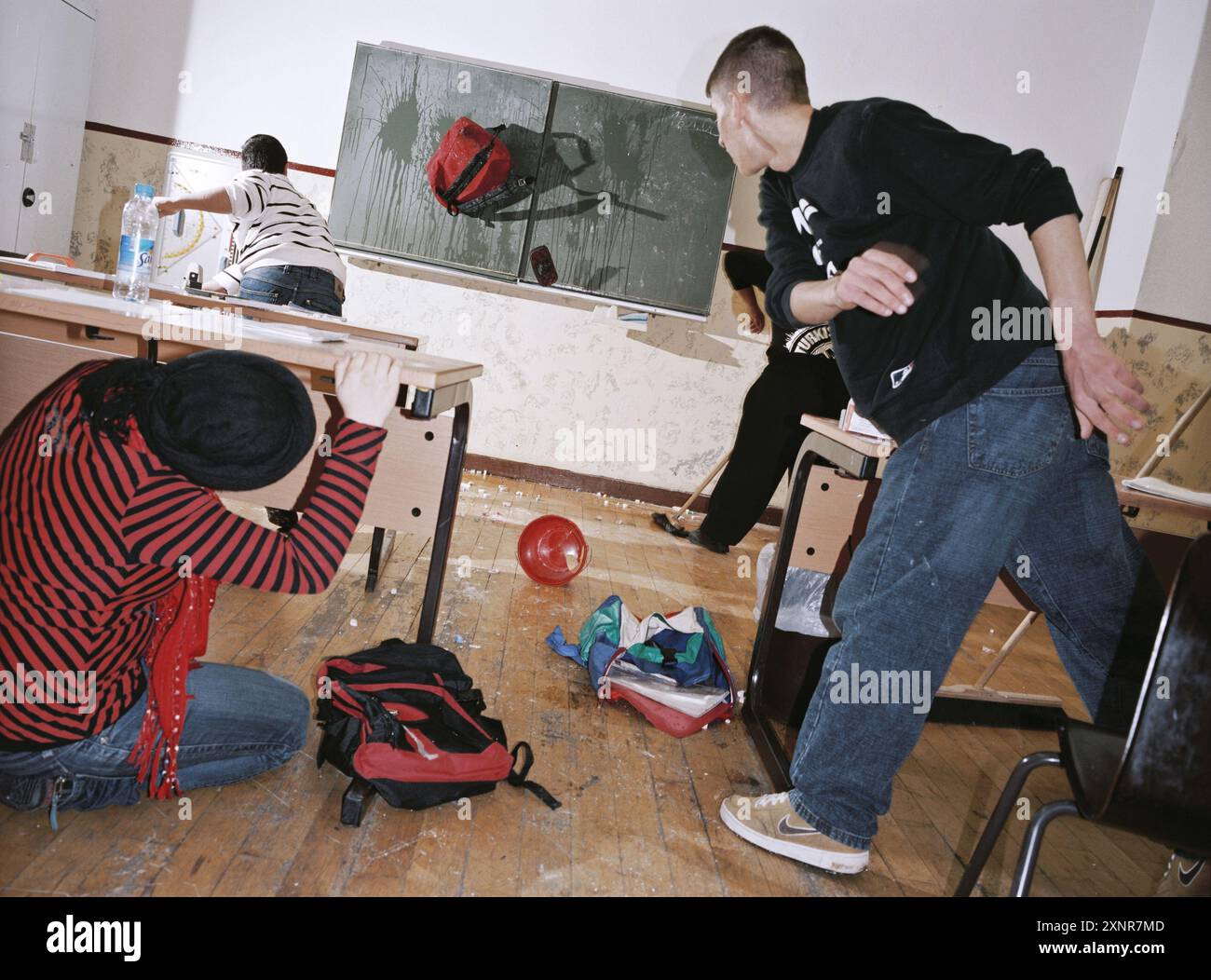 Image of a chaotic school fight with students involved in violence and ...