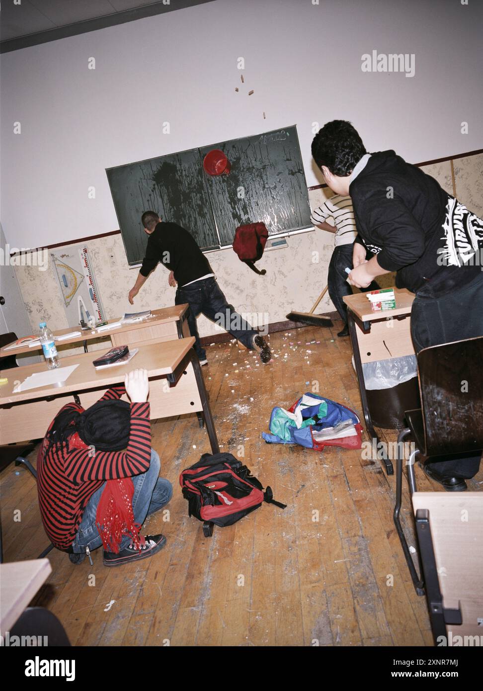 Chaotic classroom scene showing students involved in a violent brawl ...