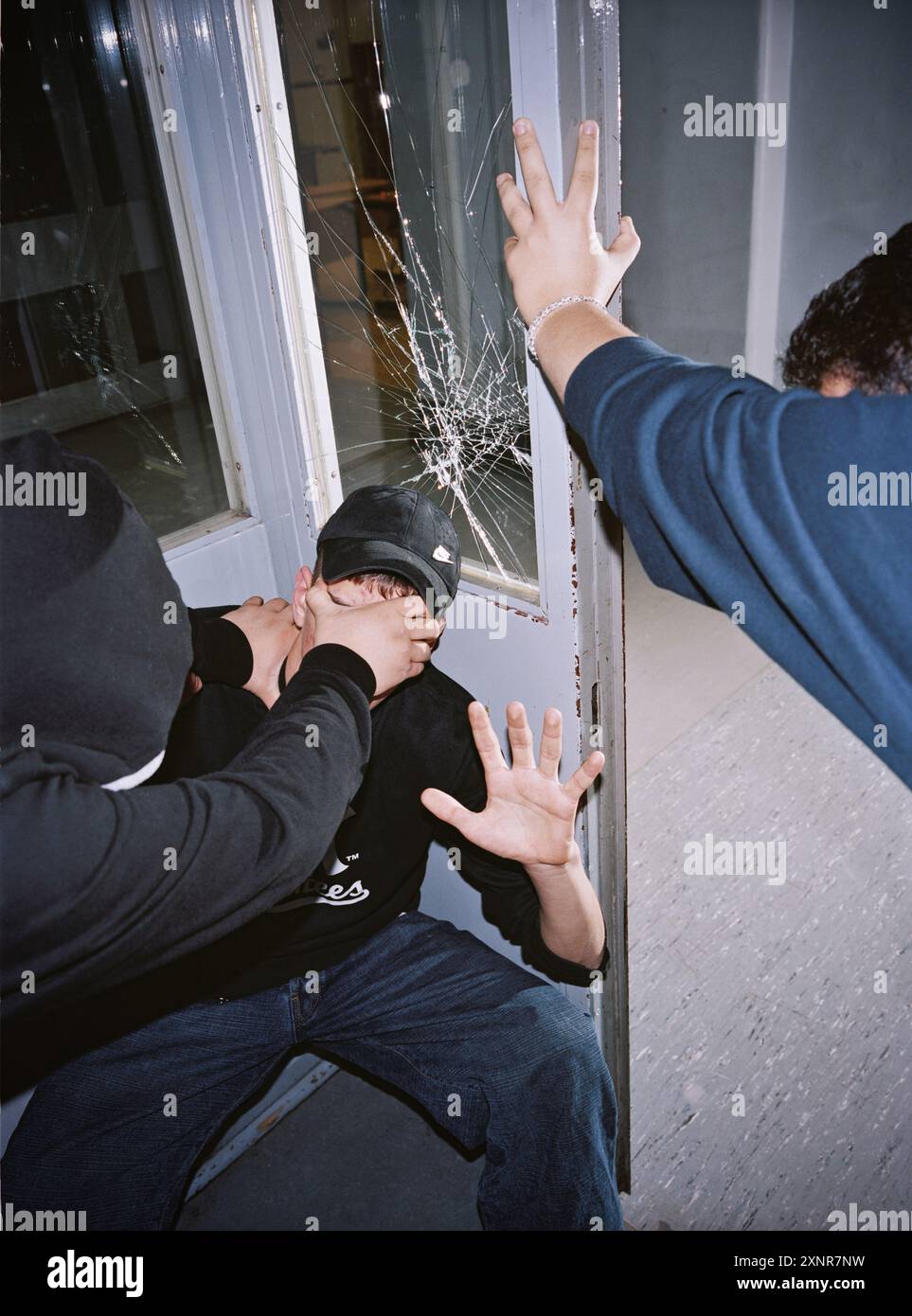 Dramatic re-enactment of school violence showing a chaotic brawl with a ...