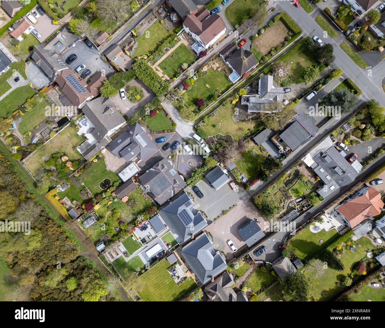 Aerial view of detached houses and gardens on Wirral Peninsula ...