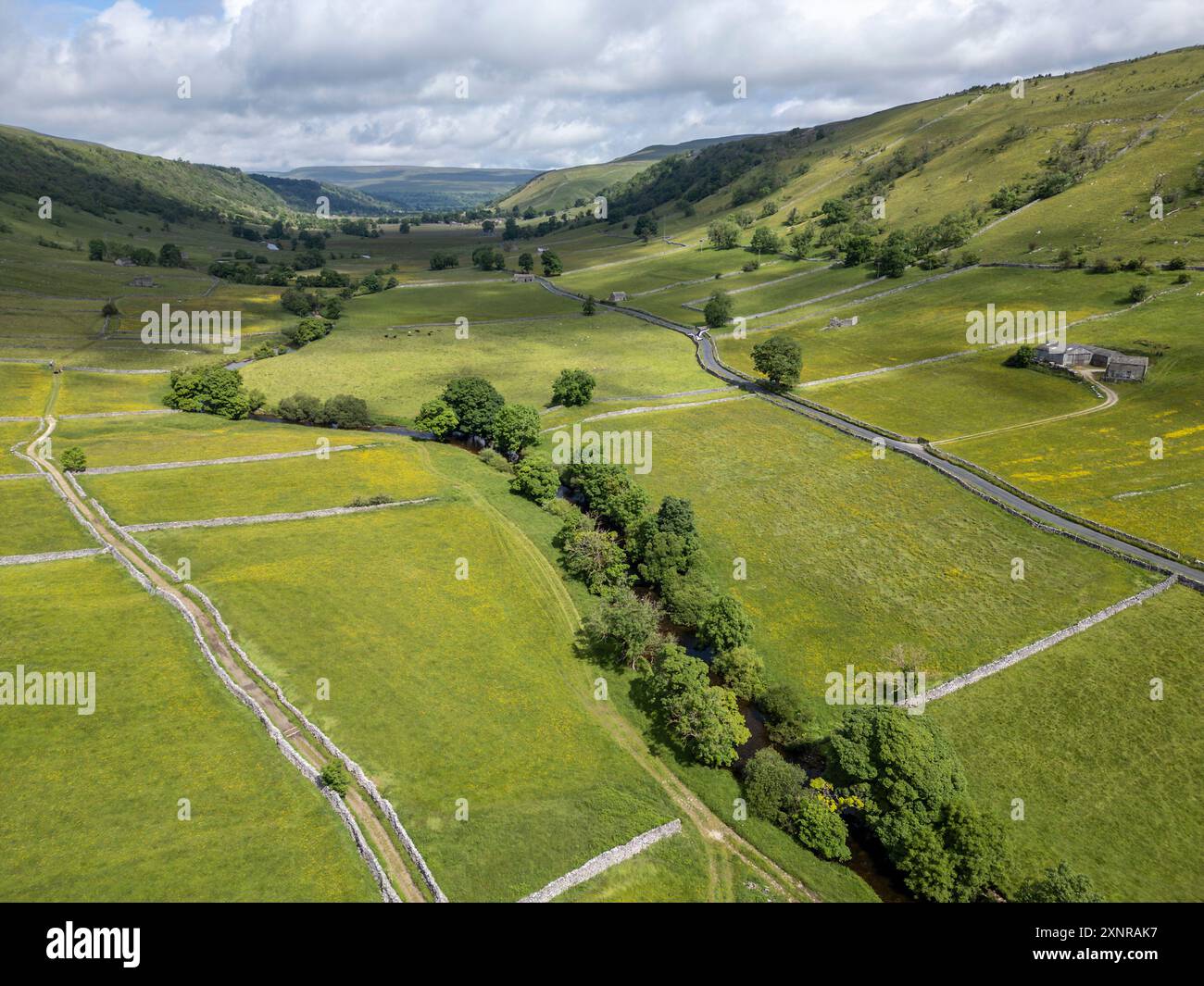 Aerial view of road through Farmland in the Wharfedale valley, North ...
