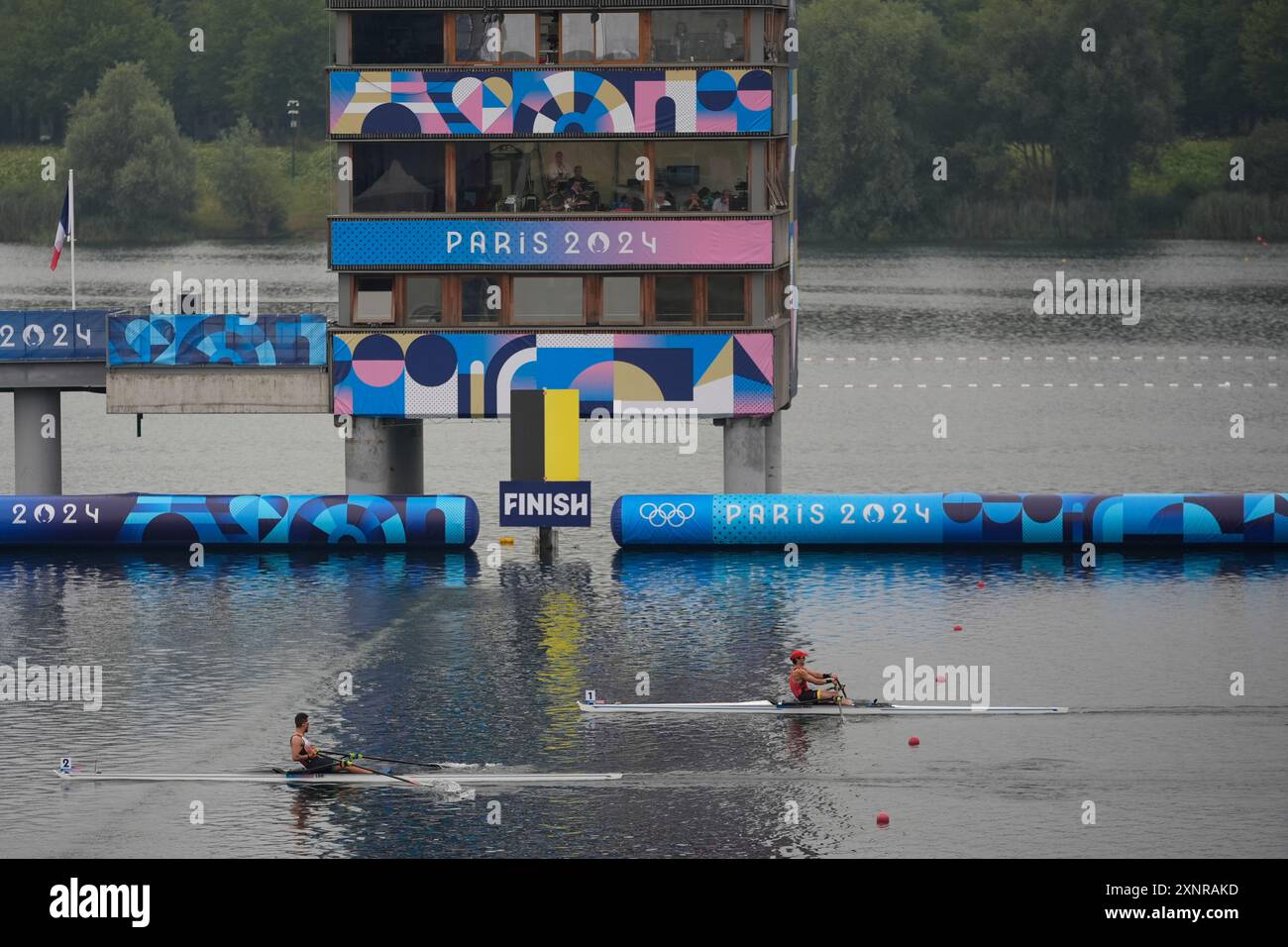 Mohamed Bukrah, of Libya, competes in the men's single sculls rowing ...