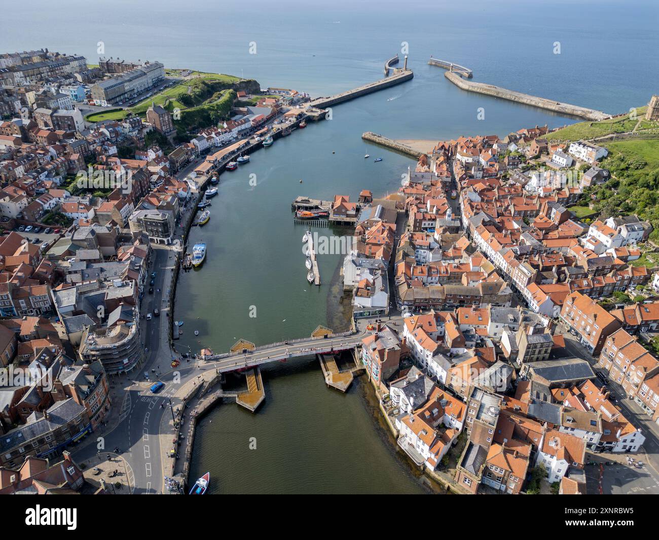 Aerial view over Whitby harbour, swing bridge and River Esk, North ...