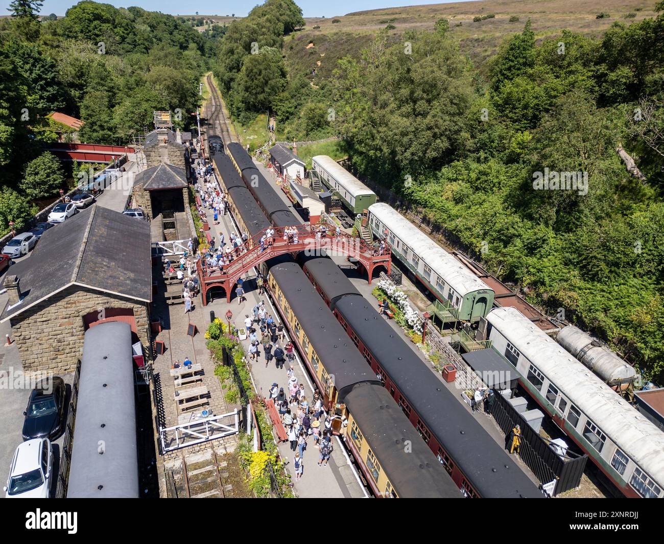 Tourists board steam train at Goathland railway station, North ...