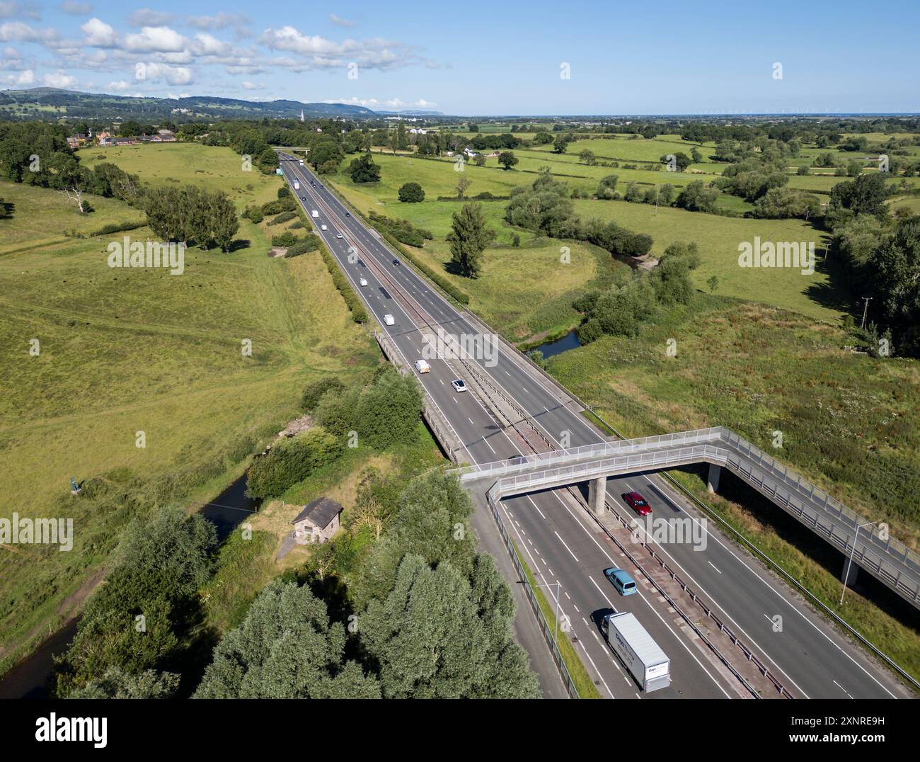 Pedestrian bridge over A55 North Wales dual carriageway road, St Asaph ...