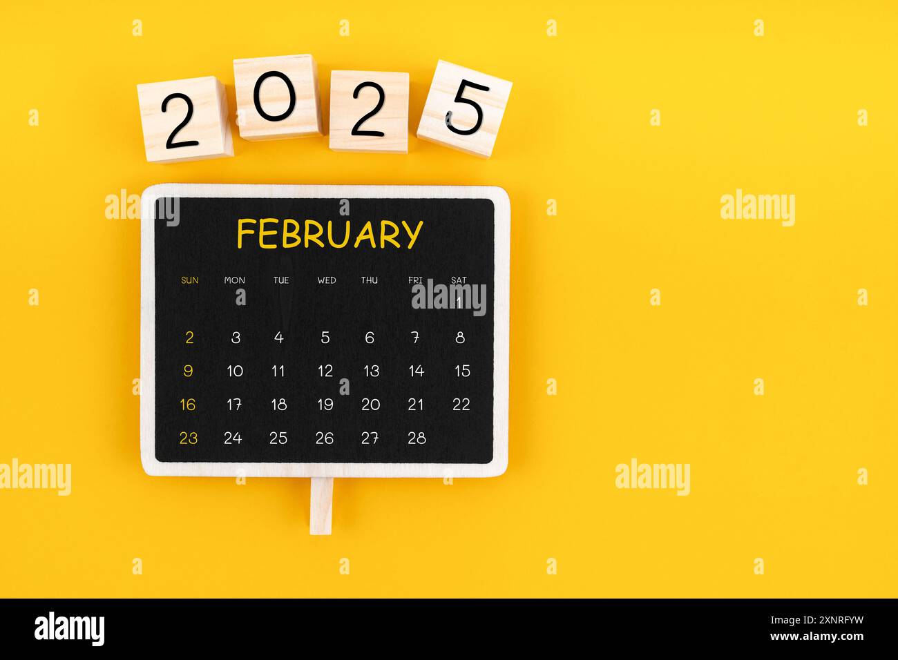 Calendar for February 2025 in black chalkboard with copy space on a ...