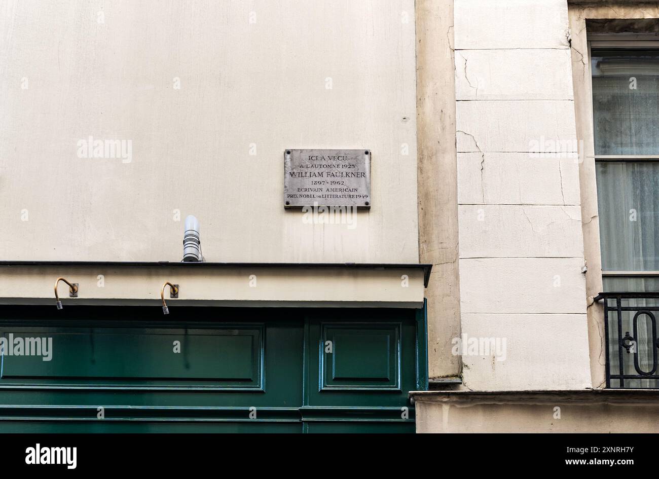 Plaque pointing the building in which the american writer William ...