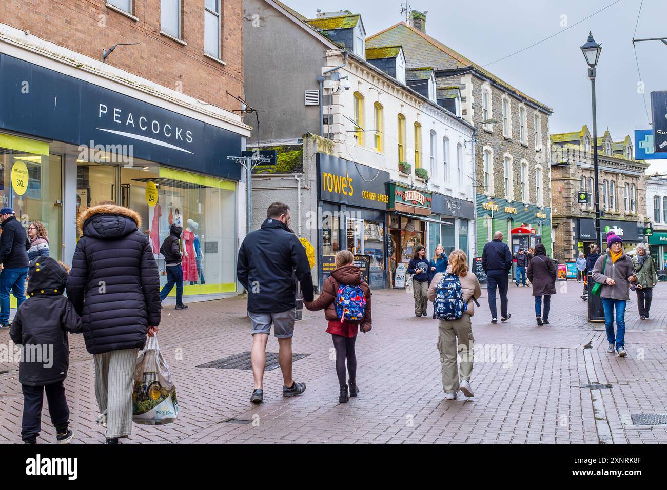 People walking along a Bank Street in Newquay town centre in Cornwall ...
