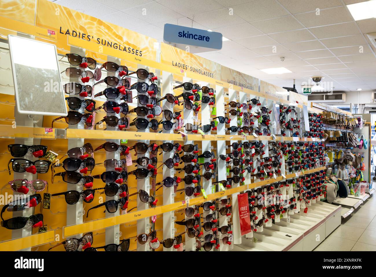 Sunglasses on sale display inside a Boots shop store in the UK Stock ...