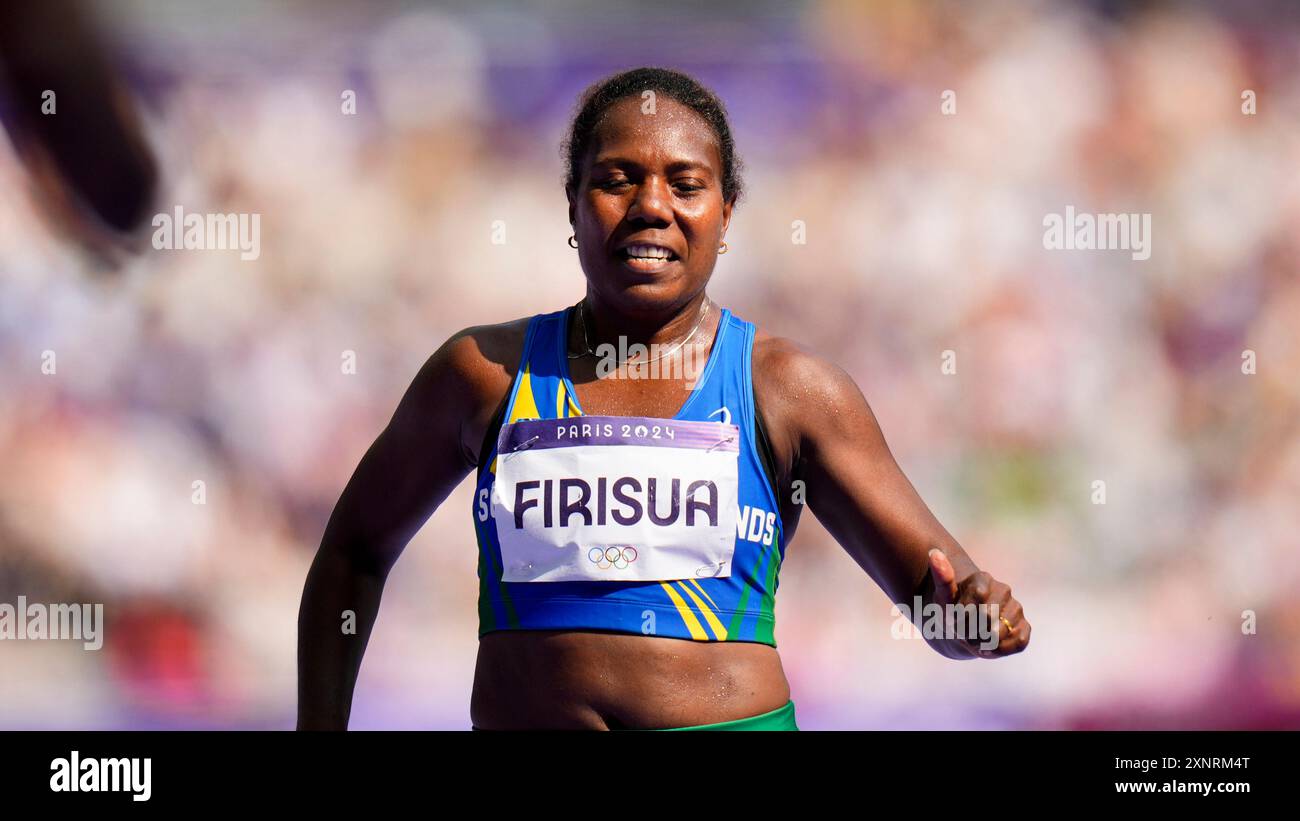Sharon Firisua, of Solomon Islands, competes in the women's 100-meter ...