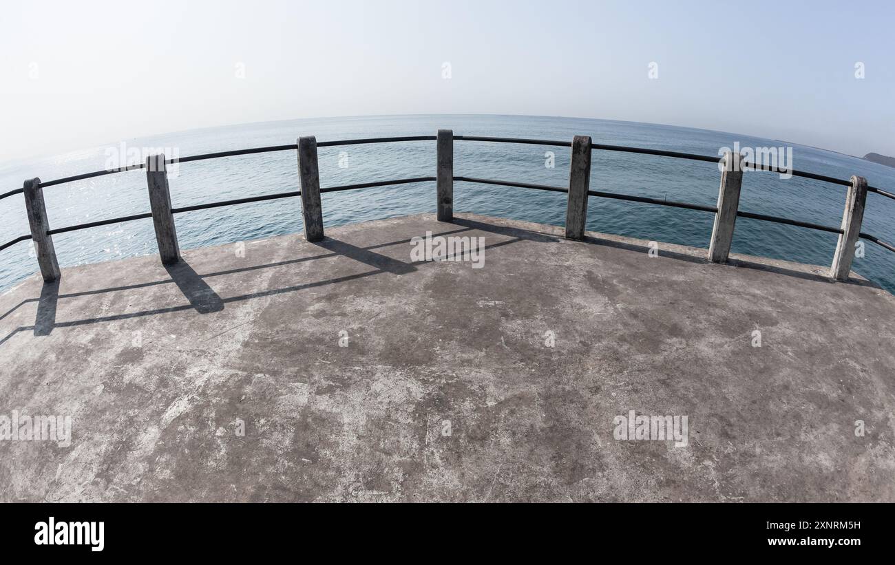 Beach Pier hand railing standing middle of jetty towards clear blue ...