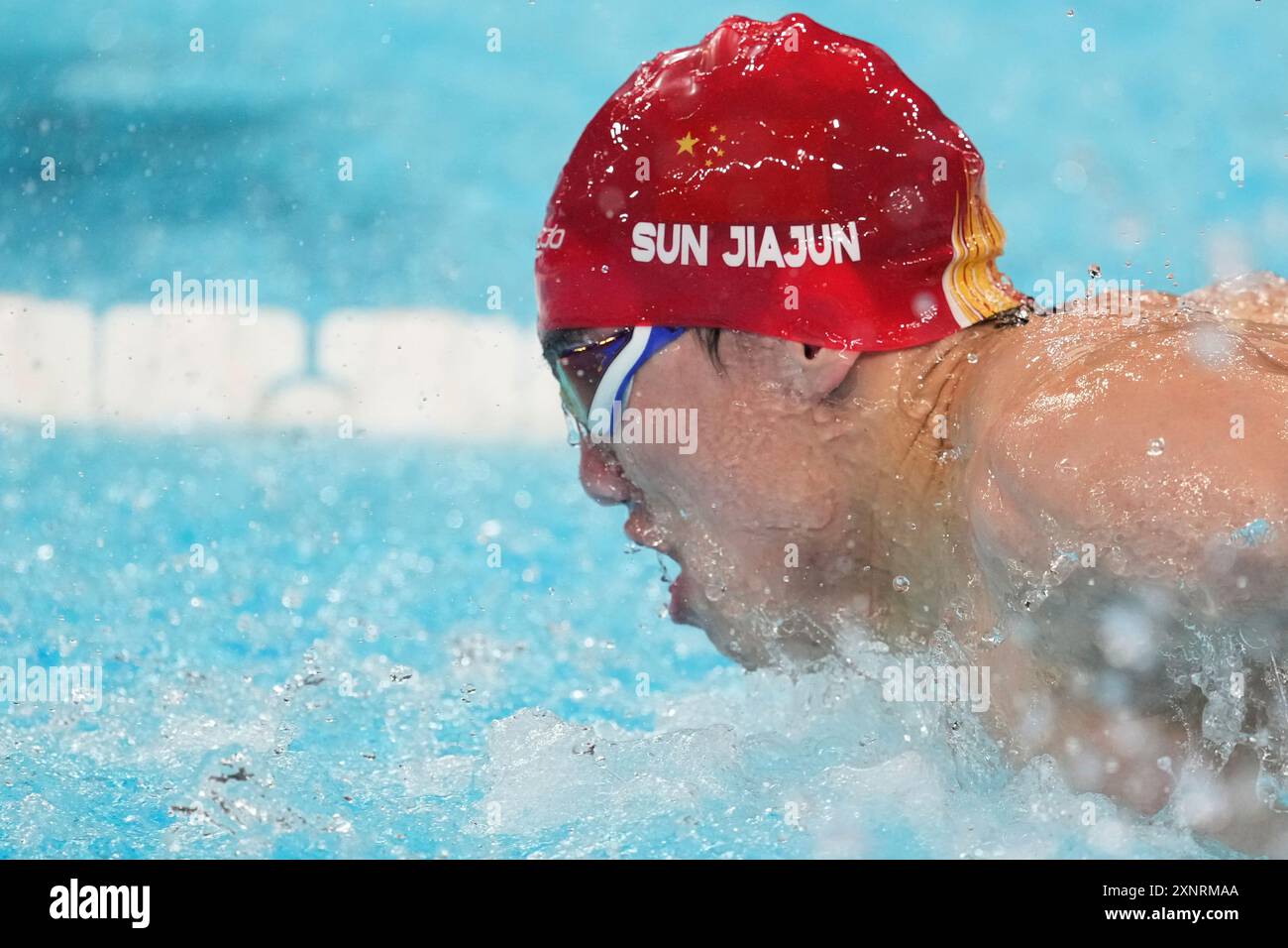 China's Jiajun Sun competes in a men's 100-meter butterfly heat at the ...