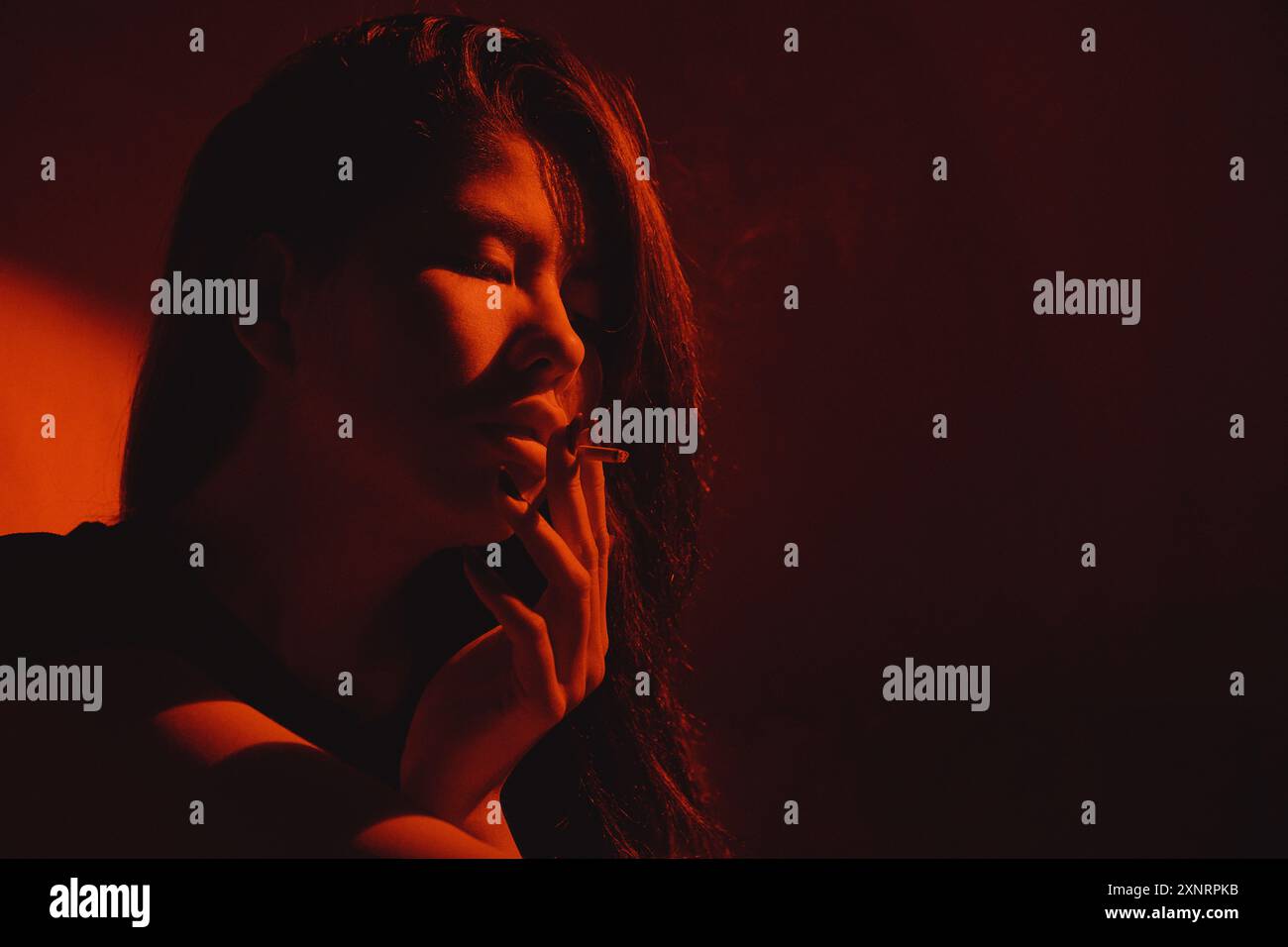 Woman lighting cigarette hi-res stock photography and images - Alamy