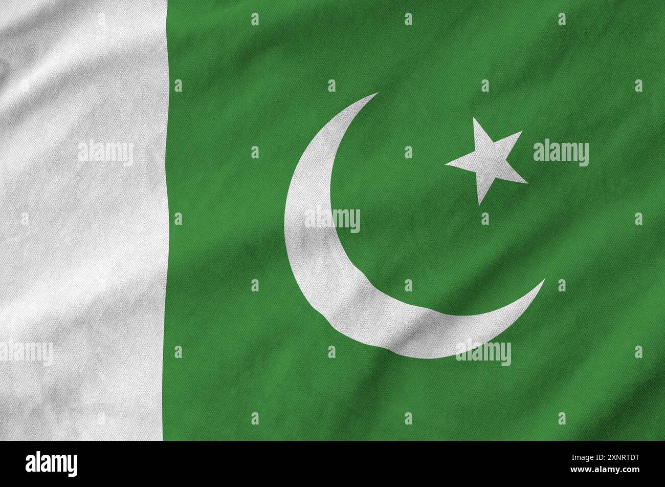 Pakistan flag depicted on folded wavy fabric of old cloth close up ...