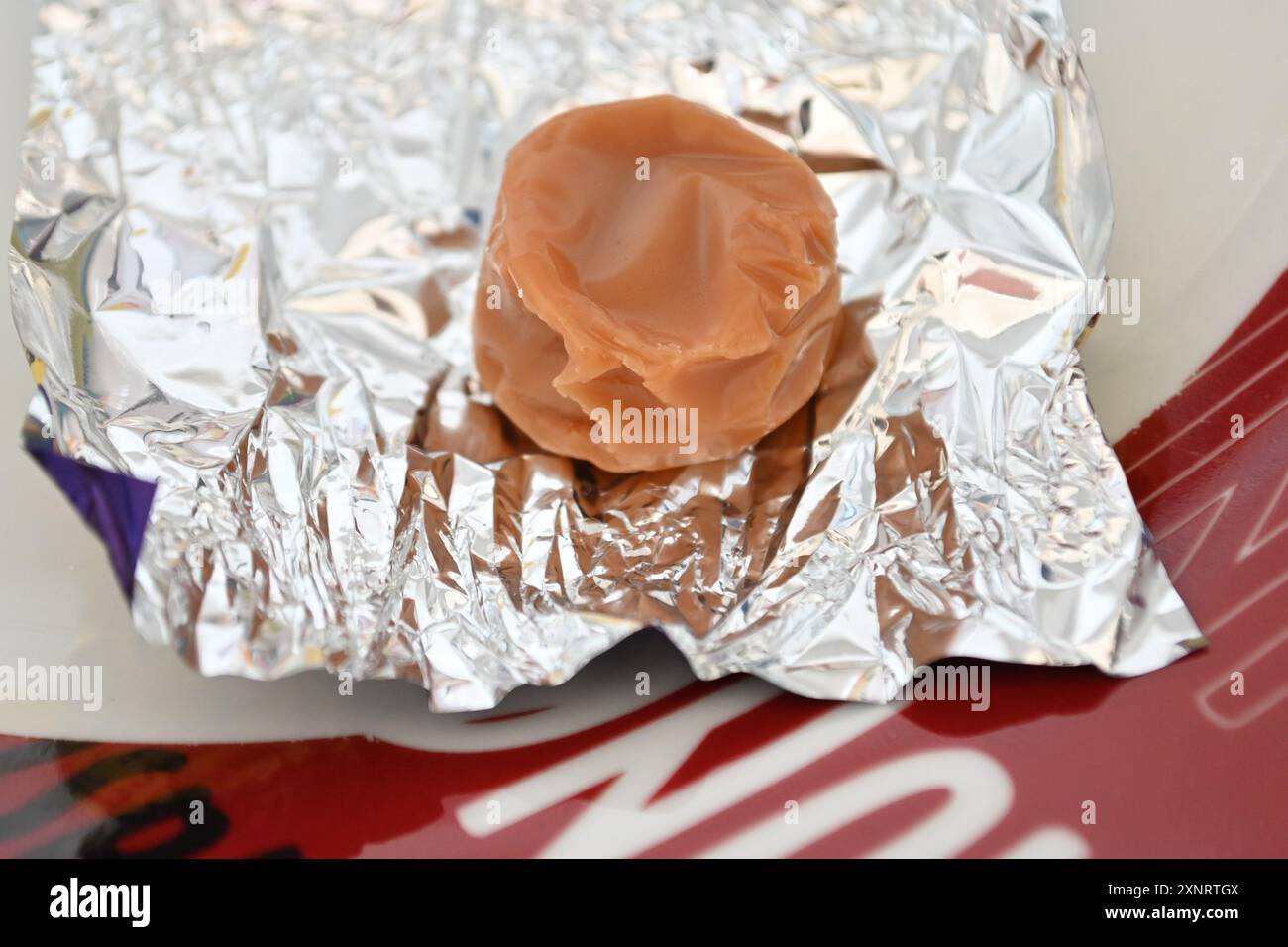 Single Toffee on Silver Wrapper Stock Photo - Alamy